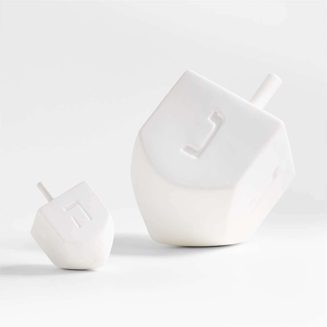 White Porcelain Dreidel Sculptures | Crate & Barrel